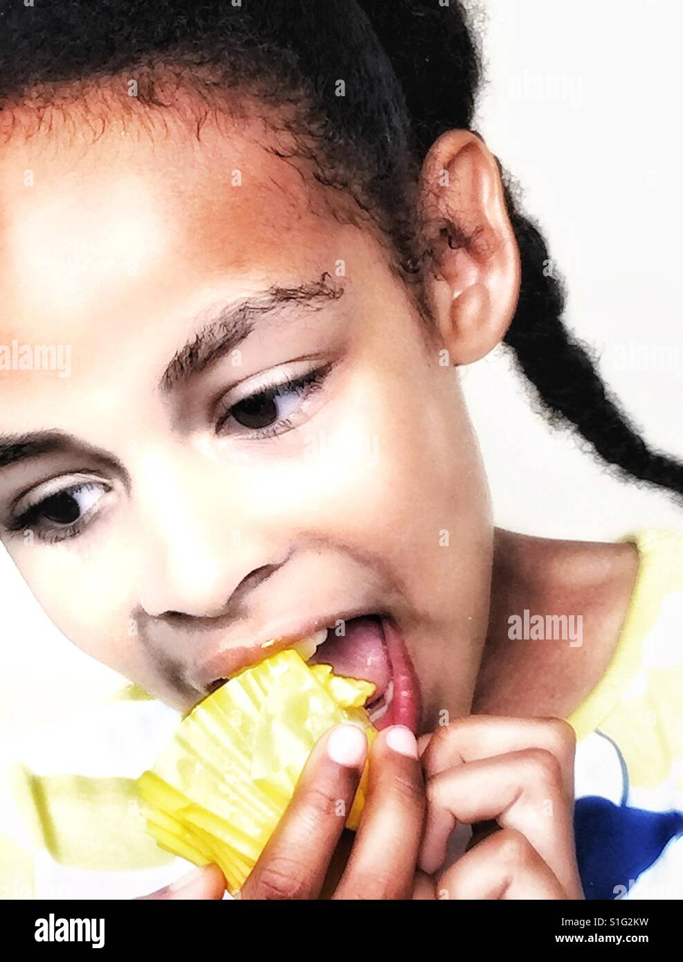 A young girl enjoys a cake Stock Photo - Alamy A young girl enjoys a cake Stock Photo - Alamy
