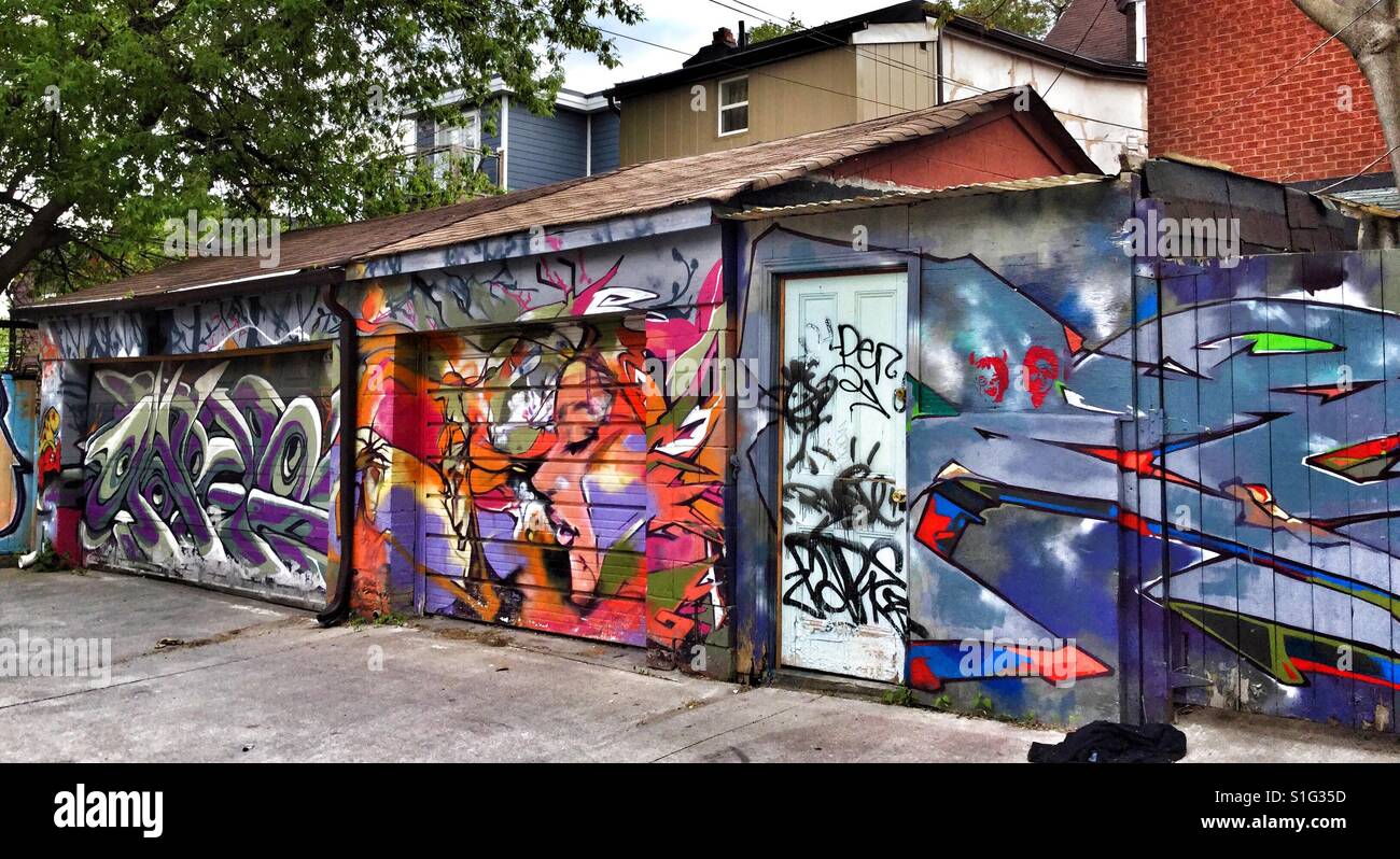 Graffiti on garage doors Stock Photo - Alamy