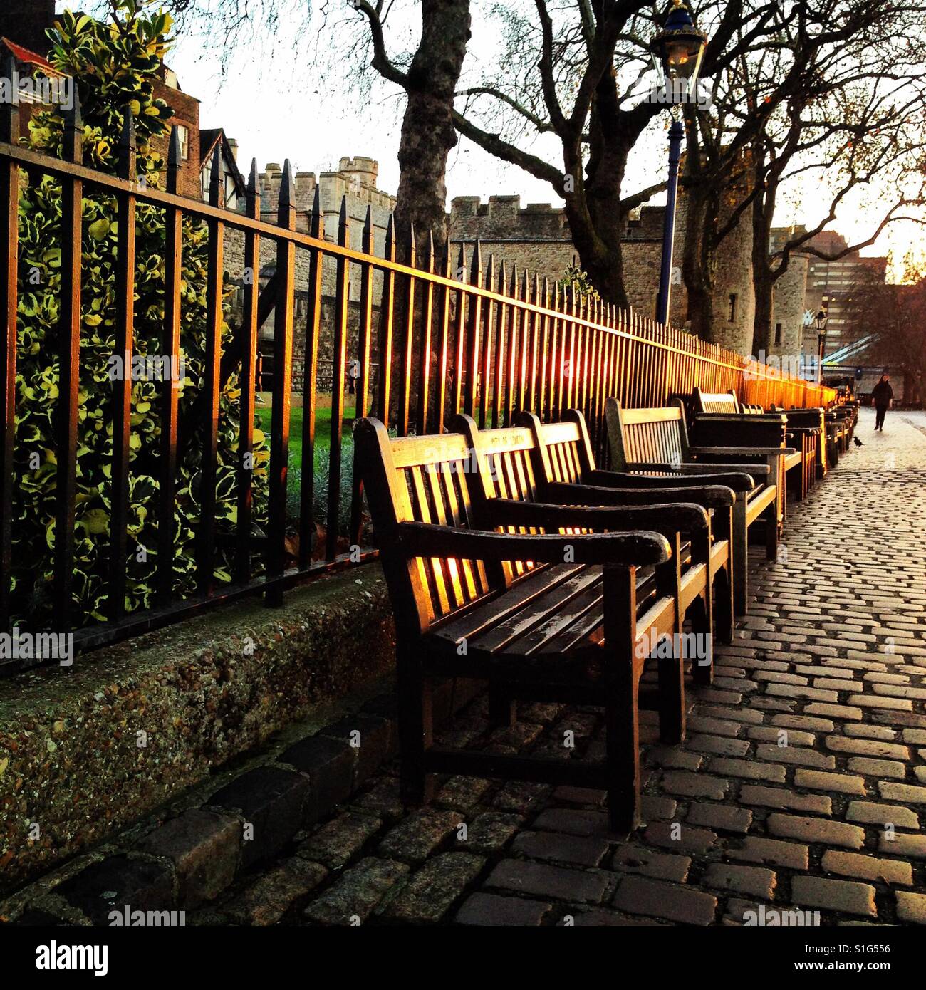 Benches on cobbled street at The Tower of London Stock Photo - Alamy
