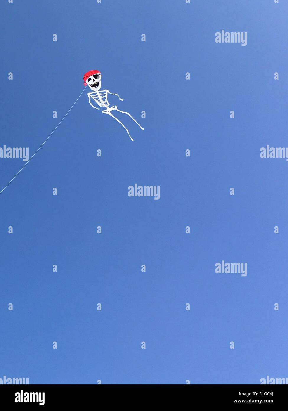 Skeleton kite in a deep blue sky Stock Photo - Alamy
