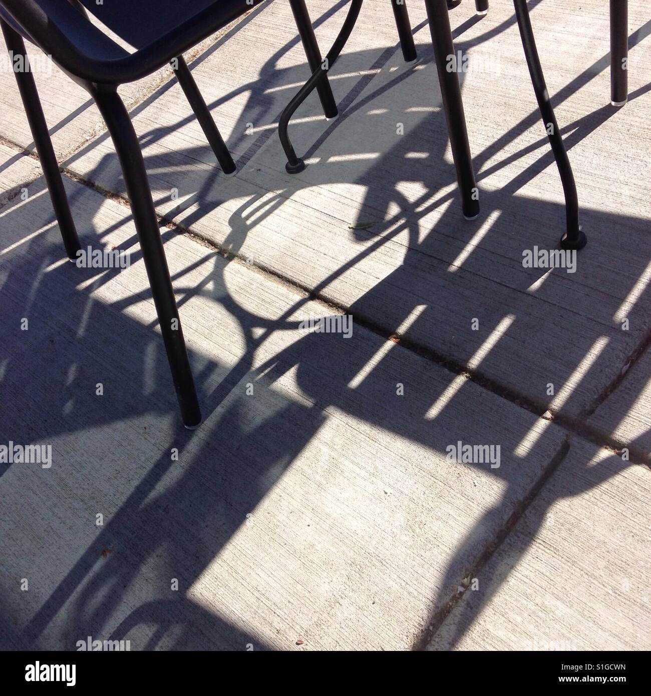 Chairs and table with shadows hi-res stock photography and images - Alamy