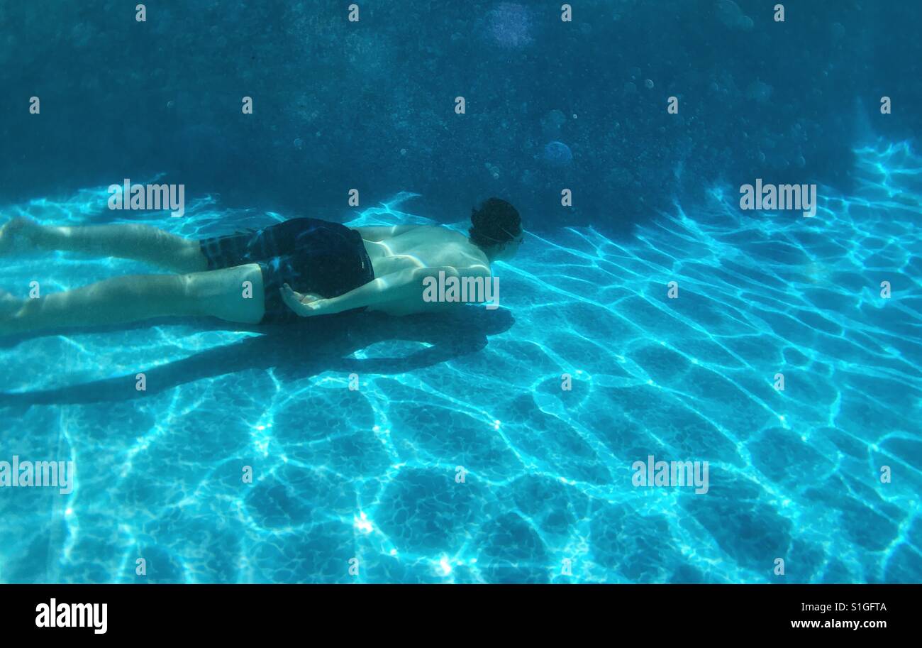 Swimmer underwater in an outdoor swimming pool Stock Photo - Alamy