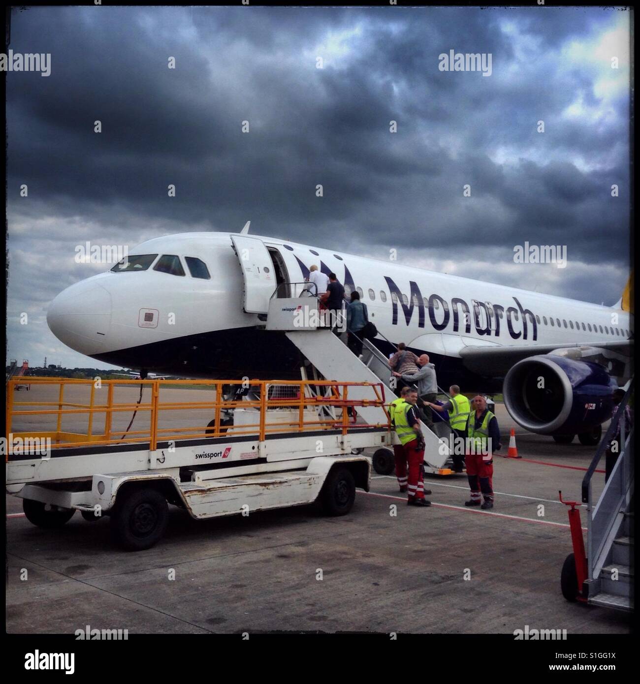 Boarding a Monarch Airways flight at Leeds Bradford Airport, UK Stock ...