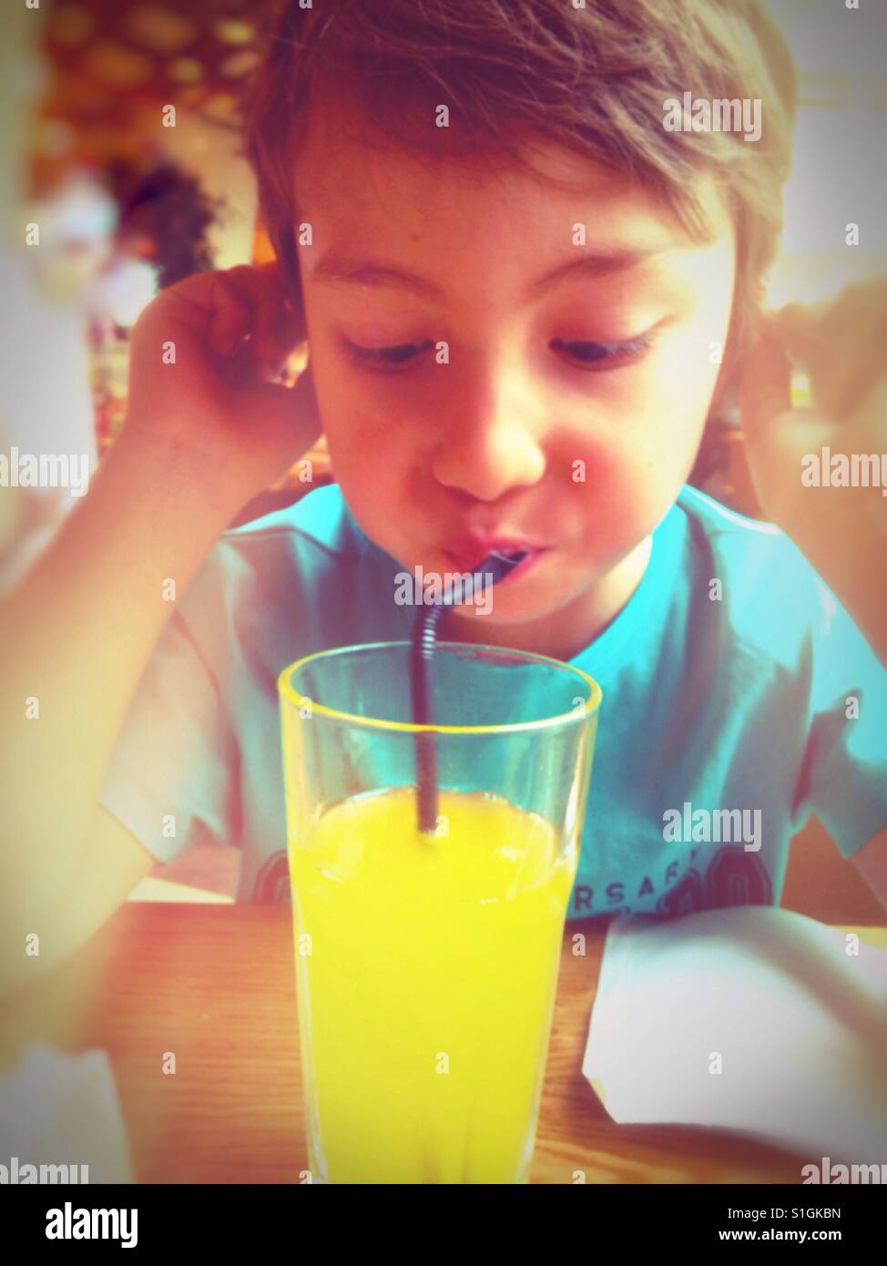 Child drinking through straw hi-res stock photography and images - Alamy