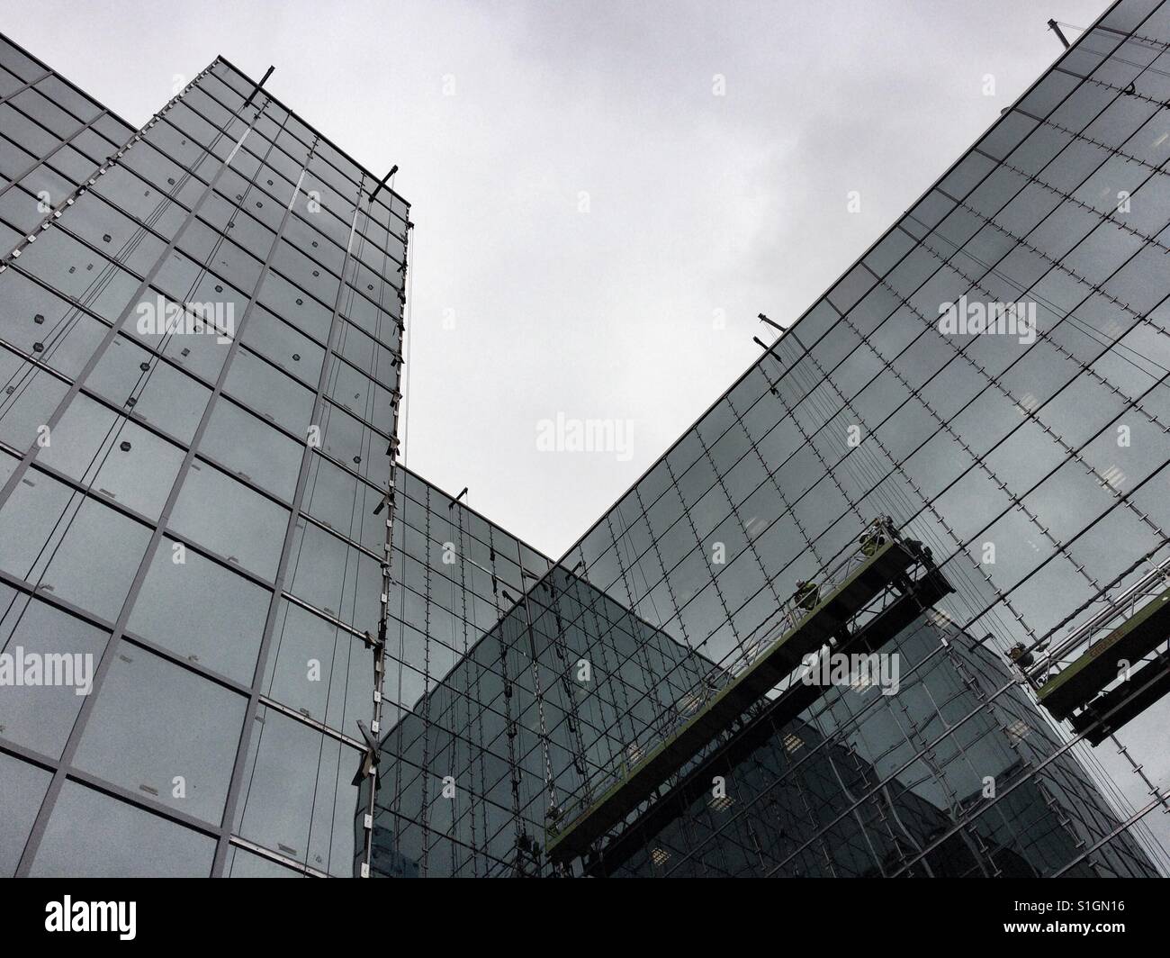 Modern glass office block under construction Stock Photo - Alamy