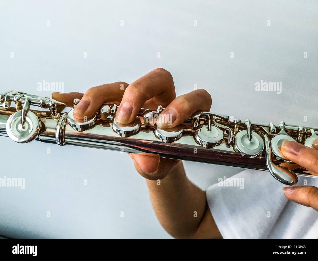 Playing the flute Stock Photo - Alamy