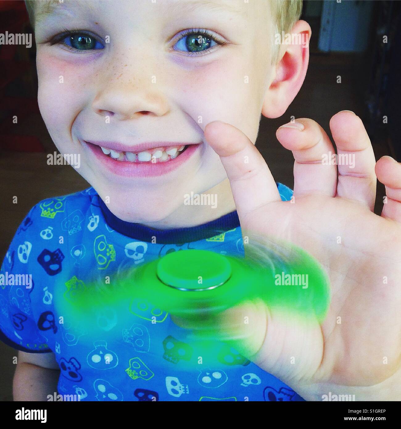 Boy with fidget spinner hi-res stock photography and images - Alamy