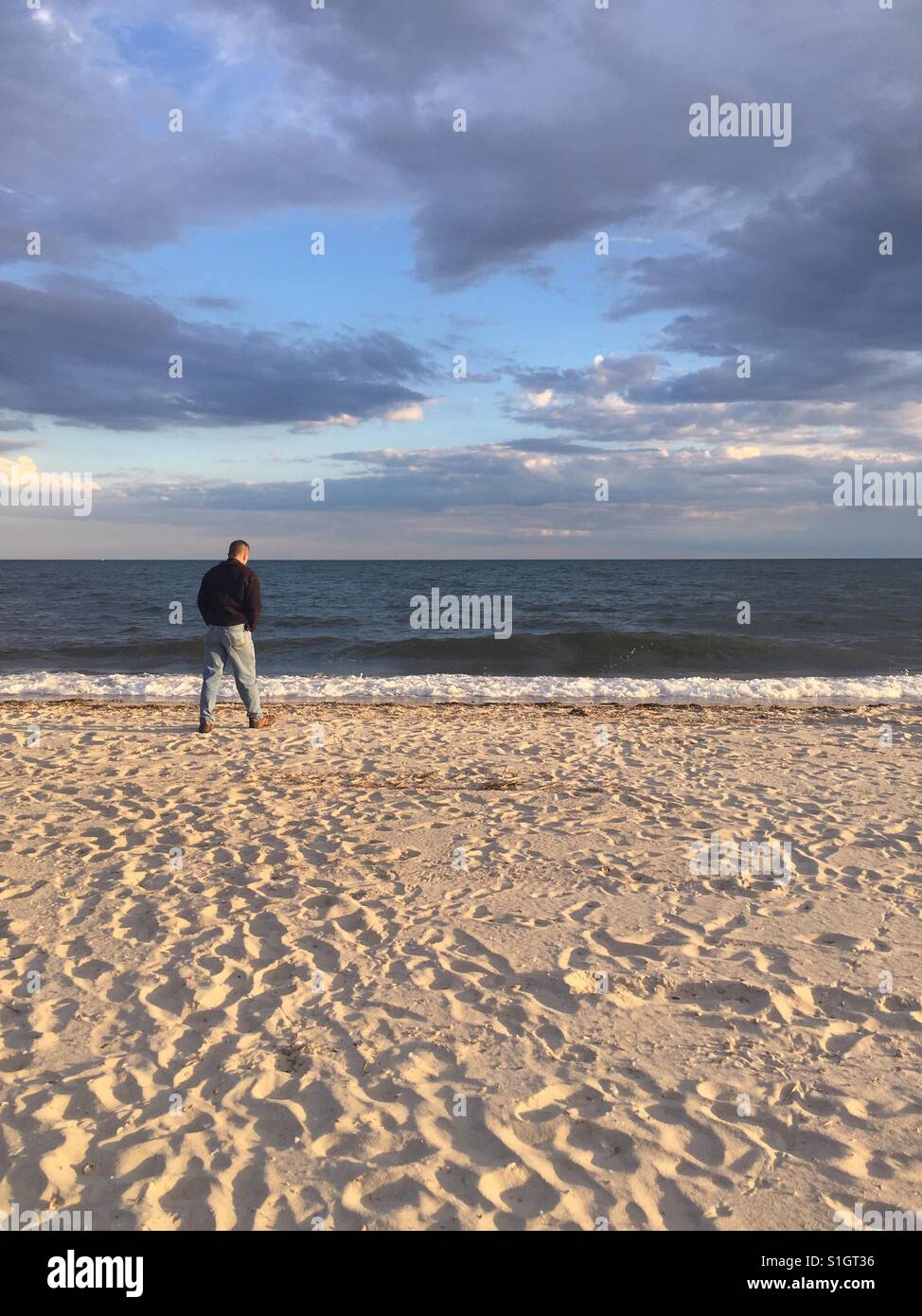 Alone at the beach Stock Photo - Alamy