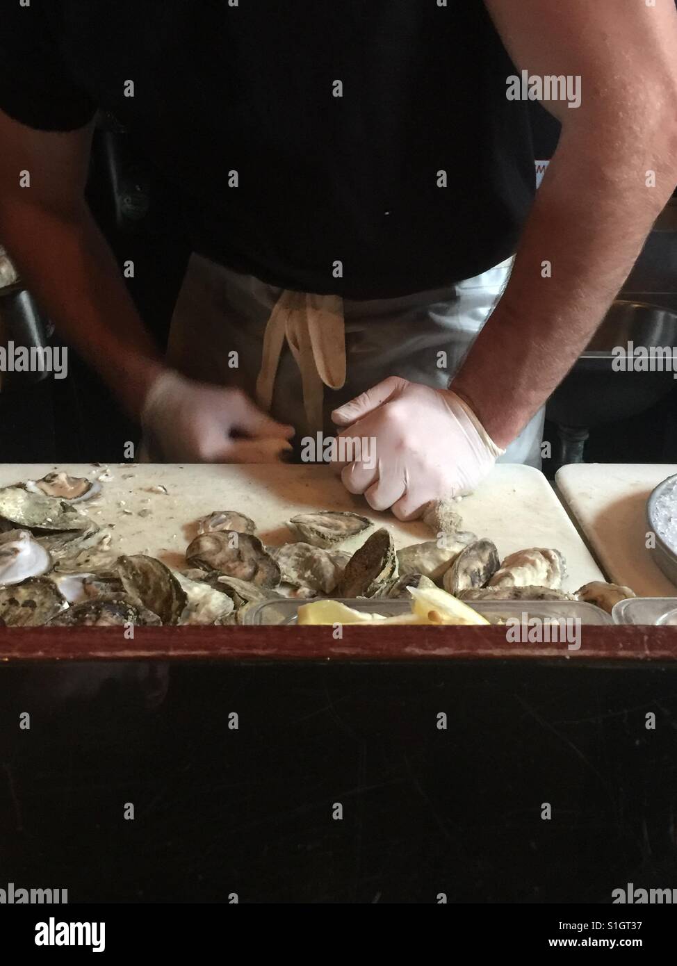 Shucking High Resolution Stock Photography and Images - Alamy