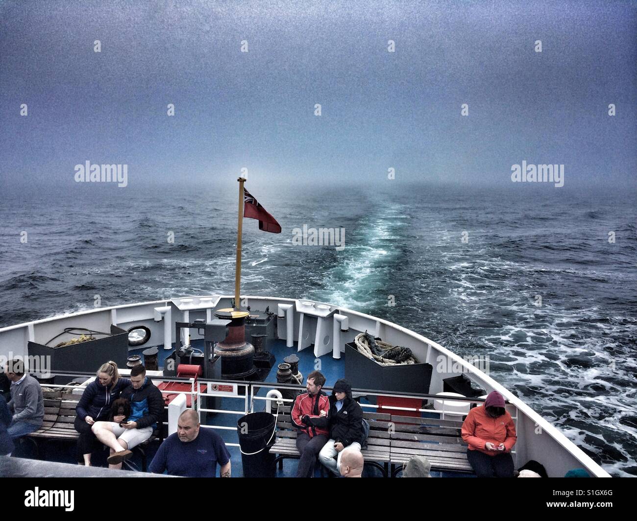 Passengers on the ferry boat Scillonian II during a cloudy, Misty ...