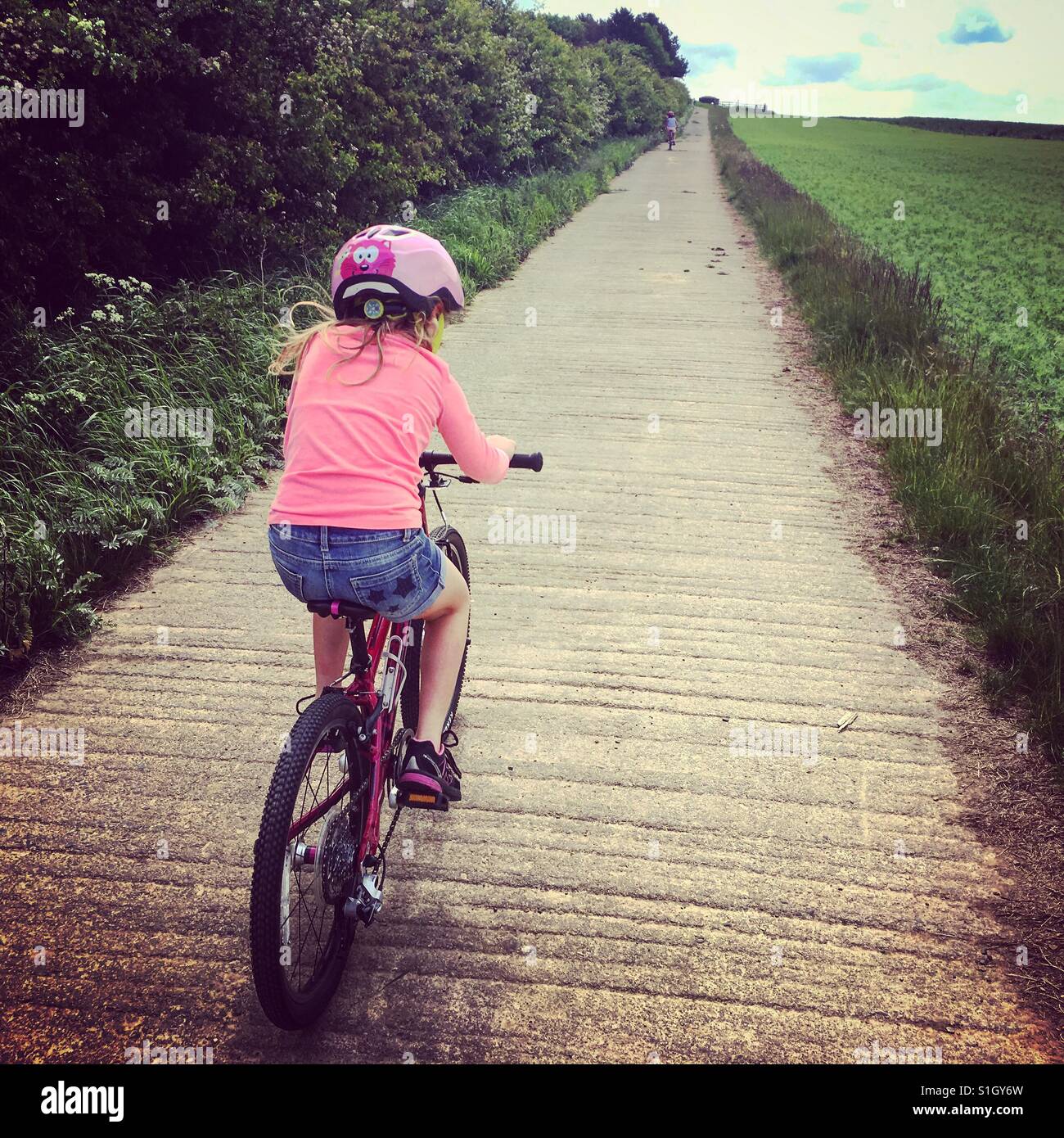 Girl on cycle hi-res stock photography and images - Alamy