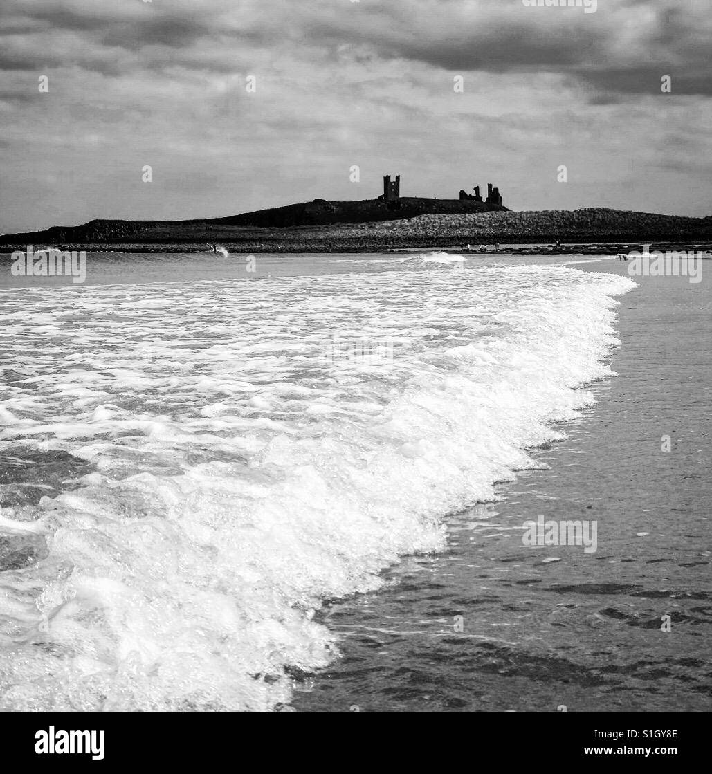 Dunstanburgh castle beach hi-res stock photography and images - Alamy