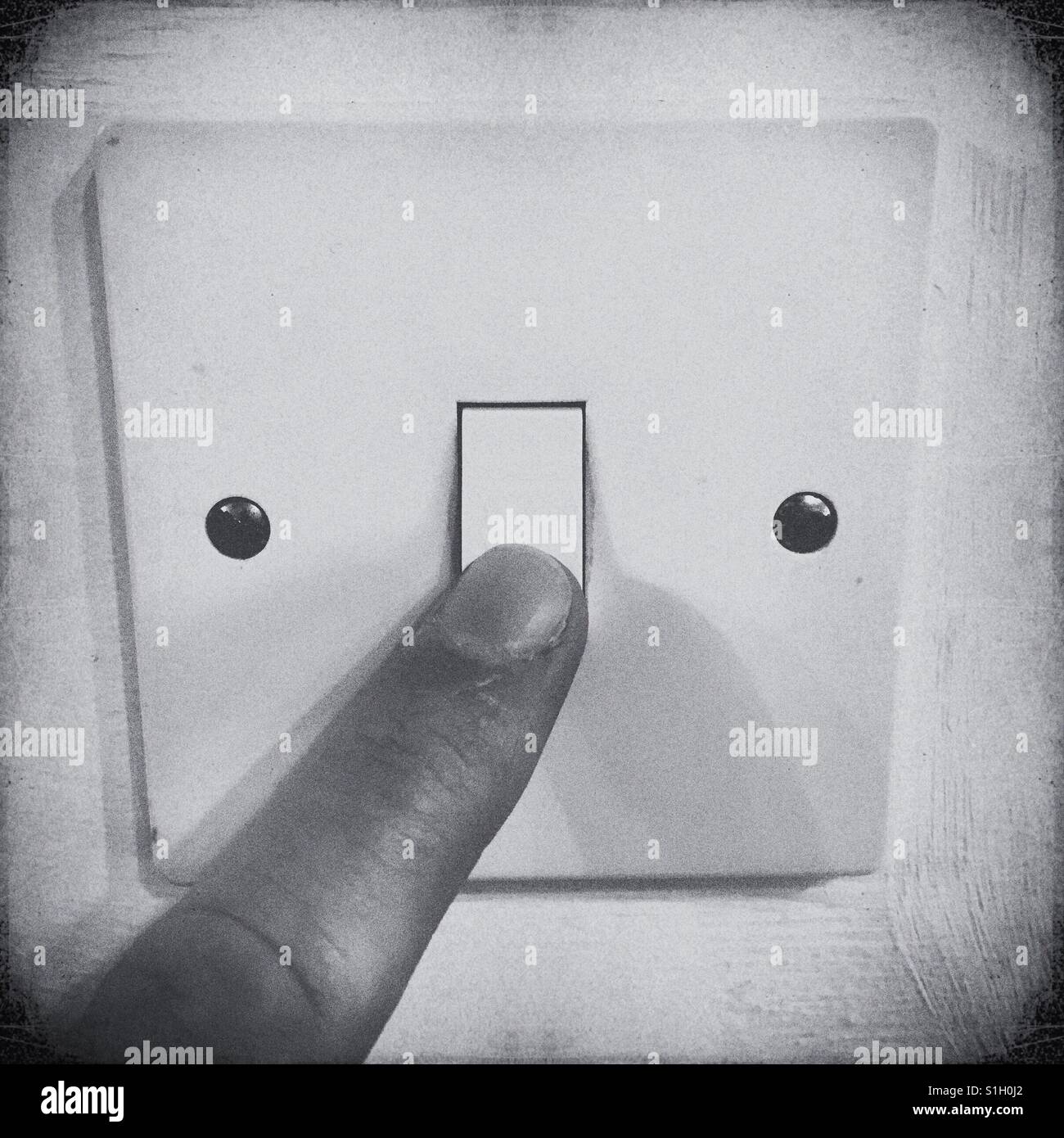 Finger switching on / off light switch Stock Photo - Alamy