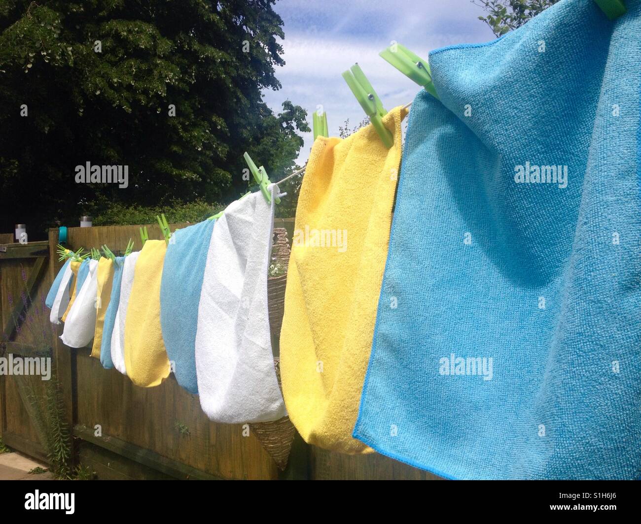 Washing line full of colour. Pegged out in the summer sunshine Stock ...