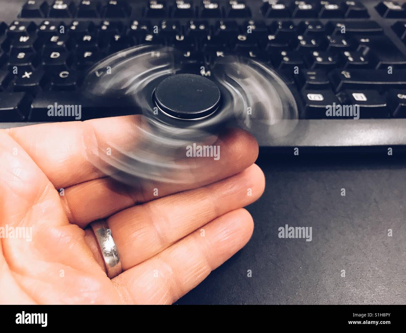 Hand spinner hi-res stock photography and images - Alamy