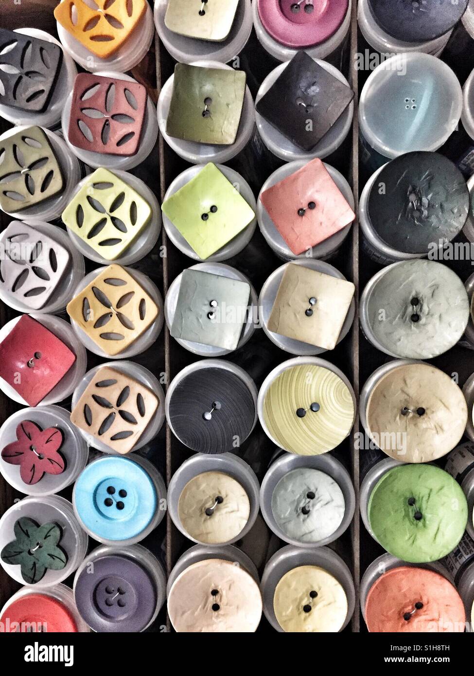 Multiple buttons on display in knitting store Stock Photo - Alamy