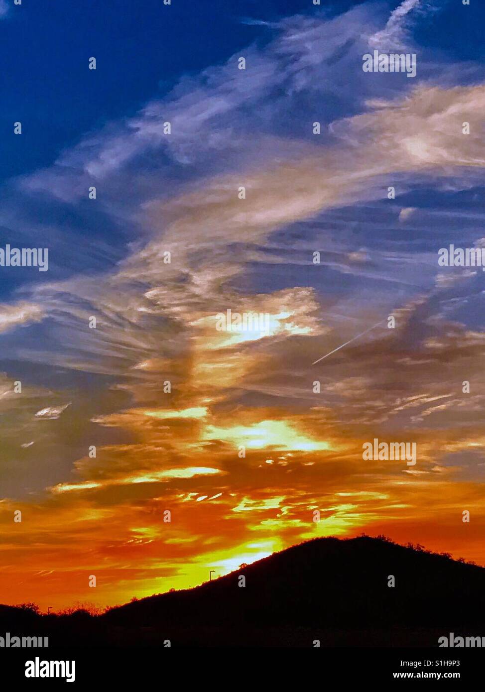 Blue orange yellow sunset hi-res stock photography and images - Alamy