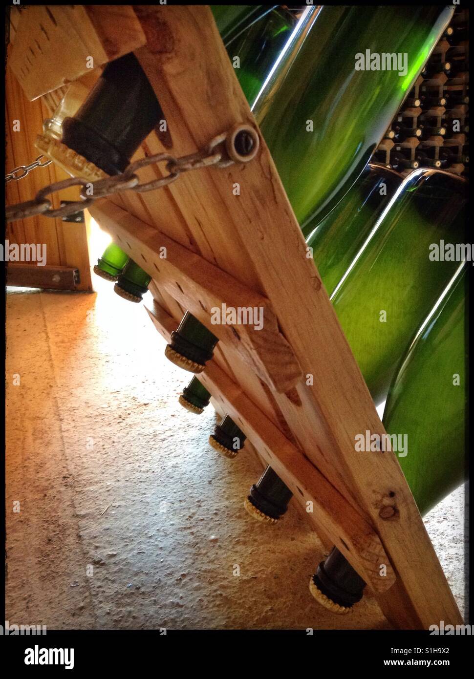 The process of riddling homemade sparkling wine using a traditional ...