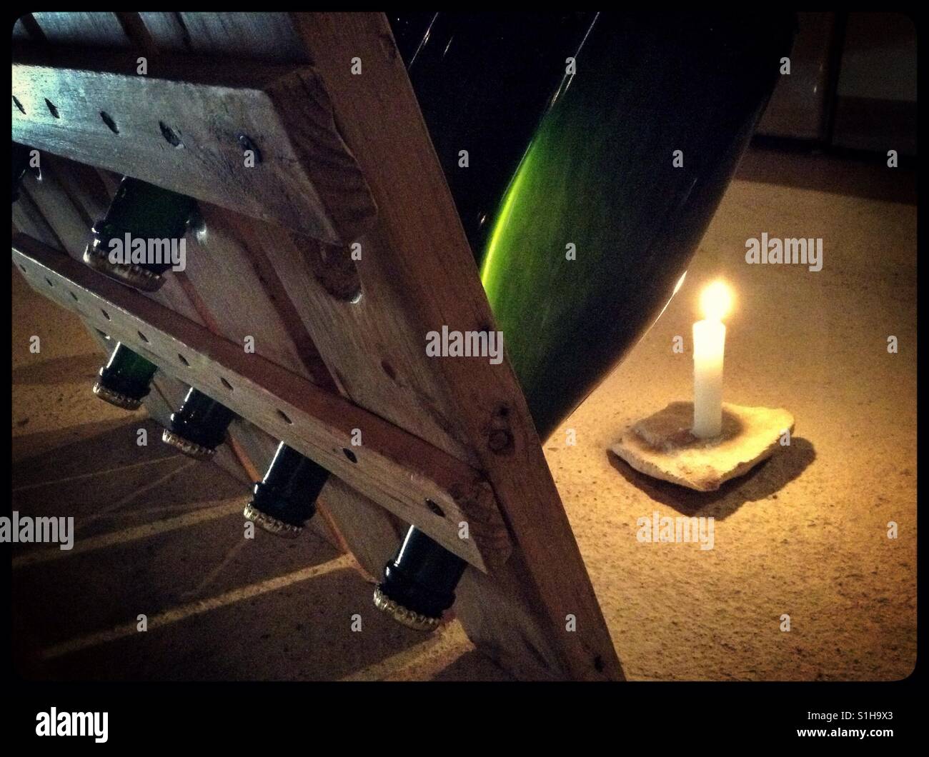 The process of riddling homemade sparkling wine using a traditional ...