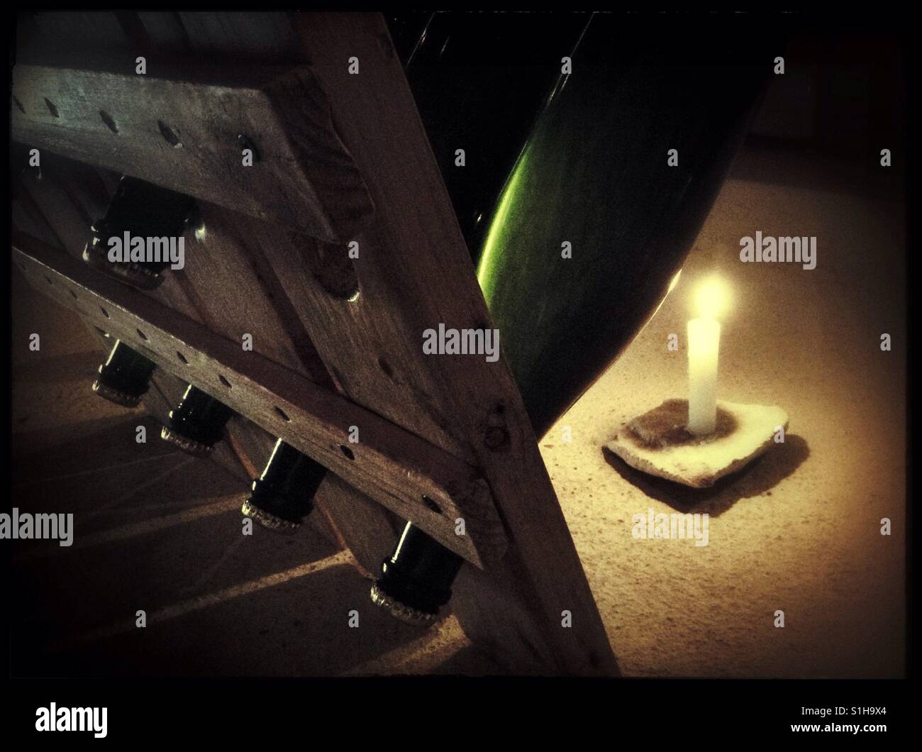 The process of riddling homemade sparkling wine using a traditional ...