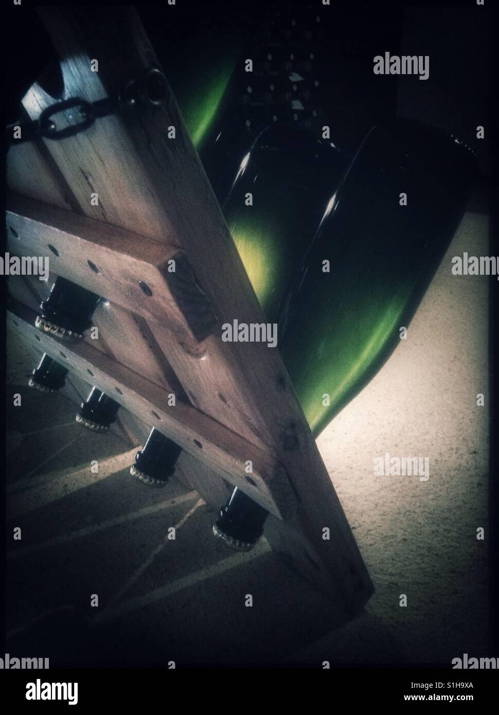 The process of riddling homemade sparkling wine using a traditional ...