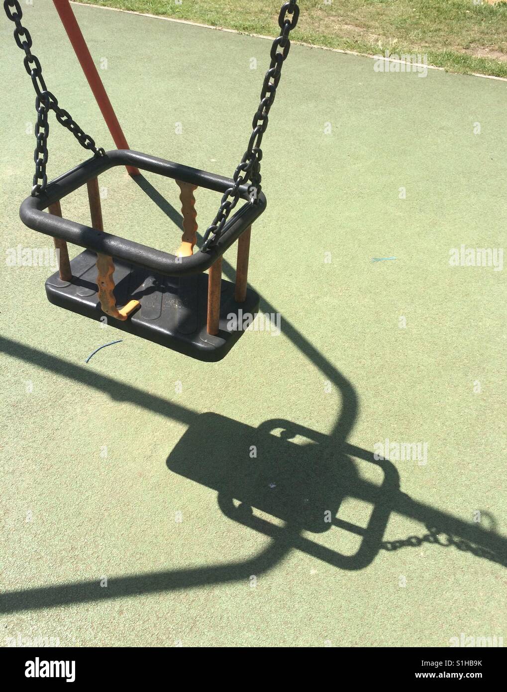 Swing in playground Stock Photo - Alamy