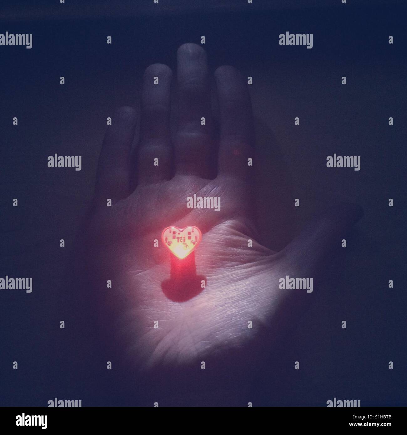 Heart in hand Stock Photo - Alamy