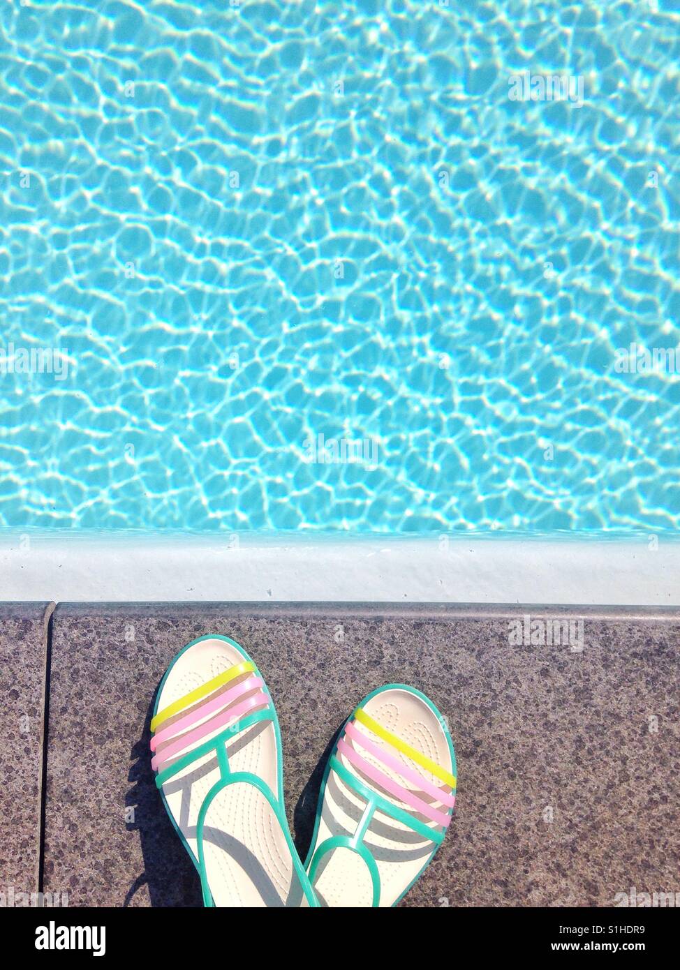 Sandals at the swimming pool Stock Photo - Alamy