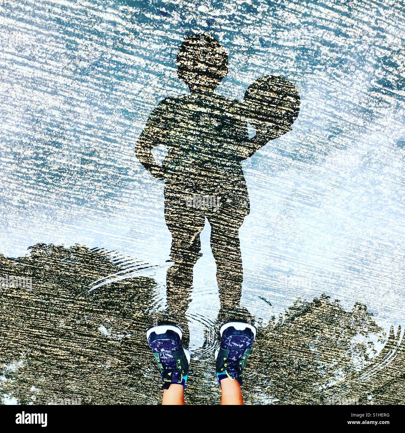 Little footballer in reflection Stock Photo - Alamy