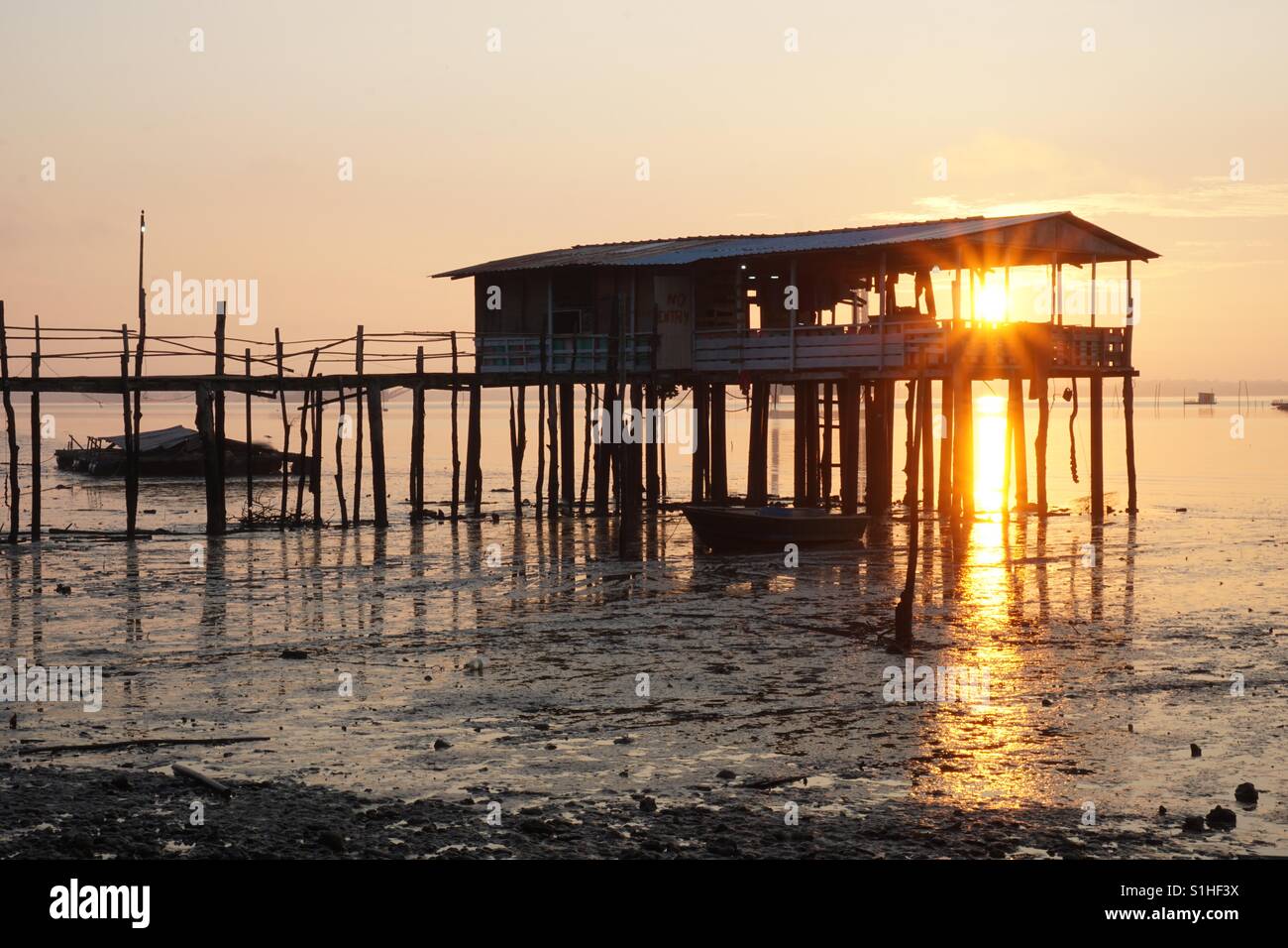 Traditional jetty during low tide Stock Photo - Alamy