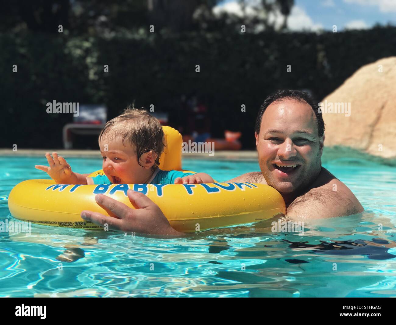 Father and baby boy having fun in swimming pool Stock Photo - Alamy
