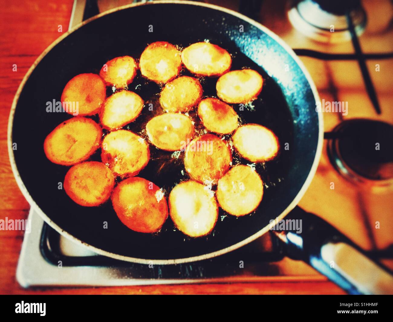 Fried potato medallions Stock Photo - Alamy