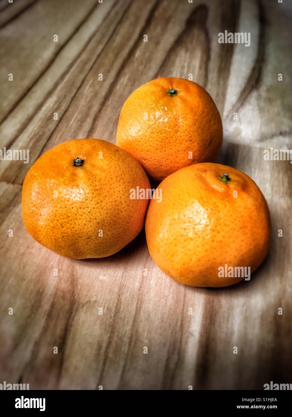 Three mandarins hi-res stock photography and images - Alamy