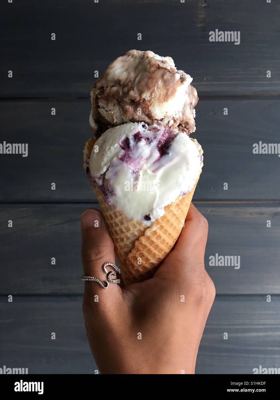 Hand holding ice cream Stock Photo - Alamy