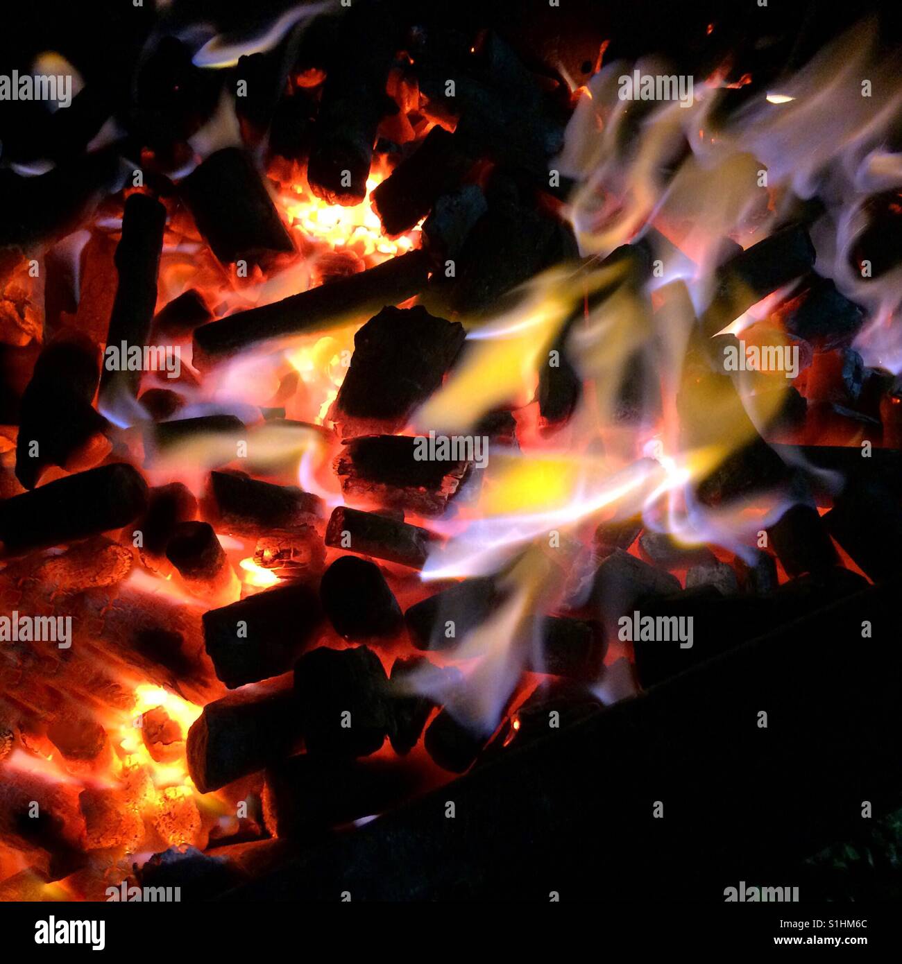 Flames from burning charcoal Stock Photo - Alamy