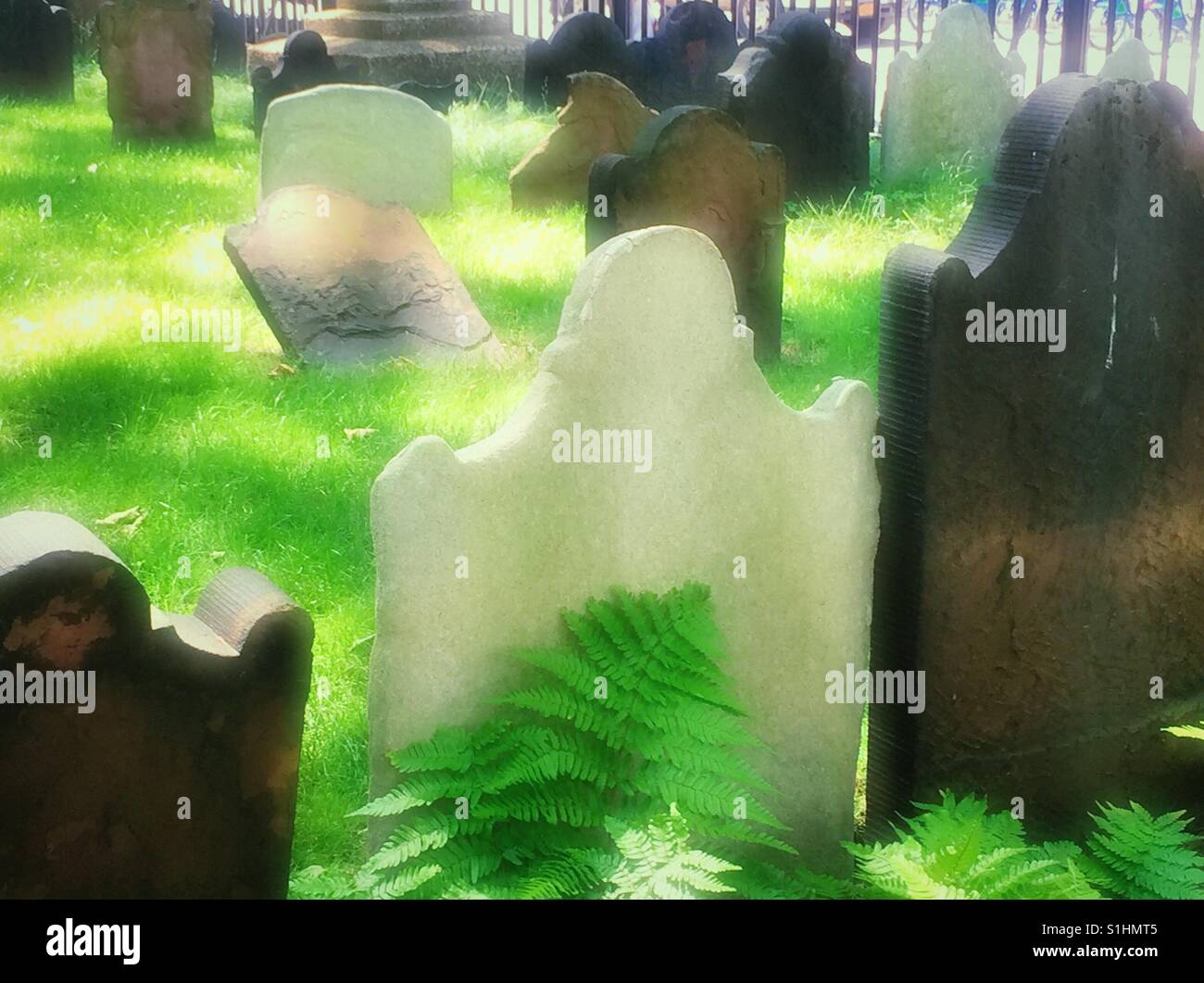 Cemetery with weatherbeaten historic old grave stones Stock Photo - Alamy