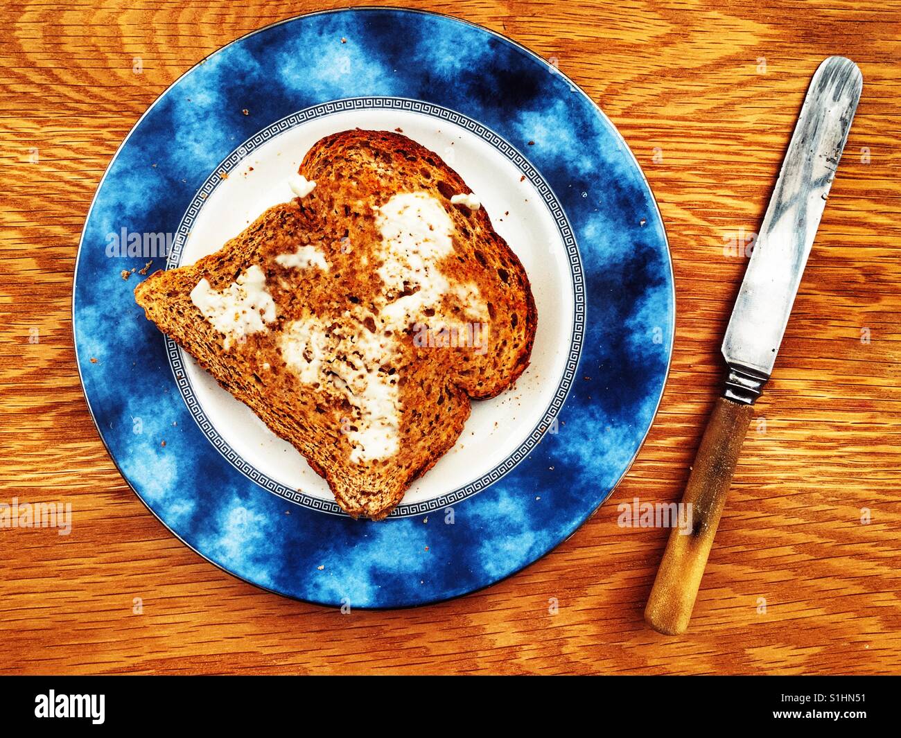 Wholemeal buttered toast Stock Photo - Alamy