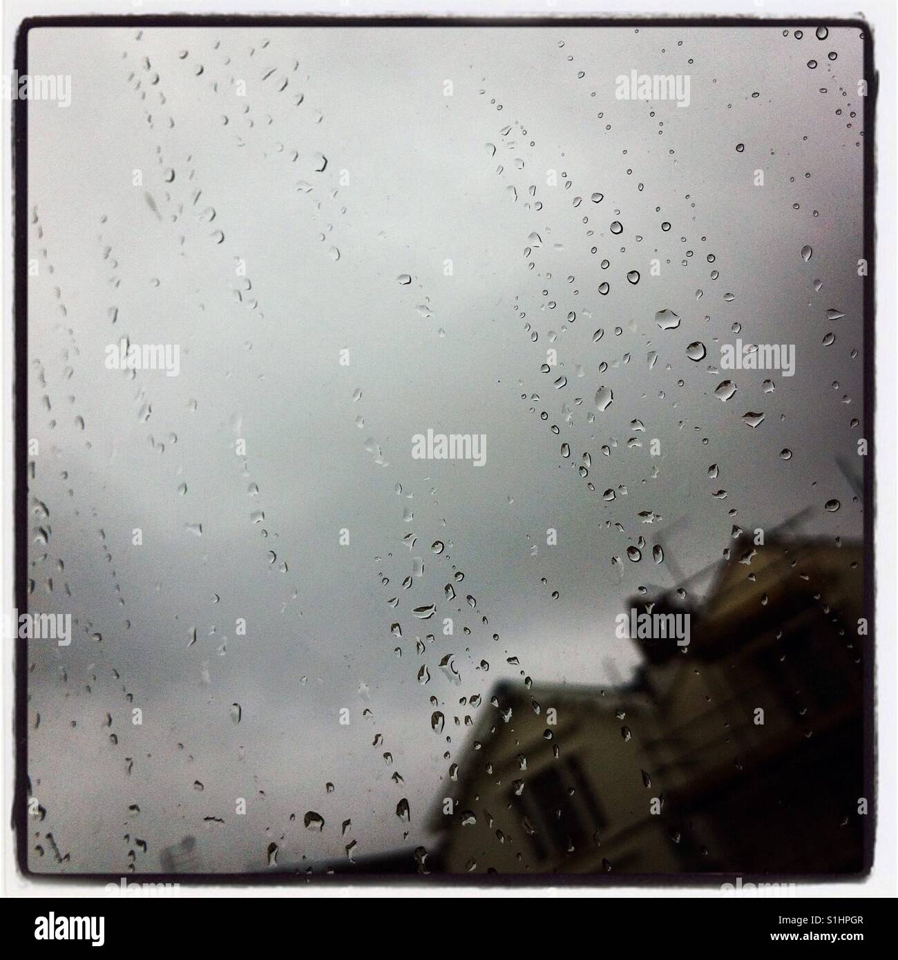 Rain drops rolling down the window Stock Photo - Alamy