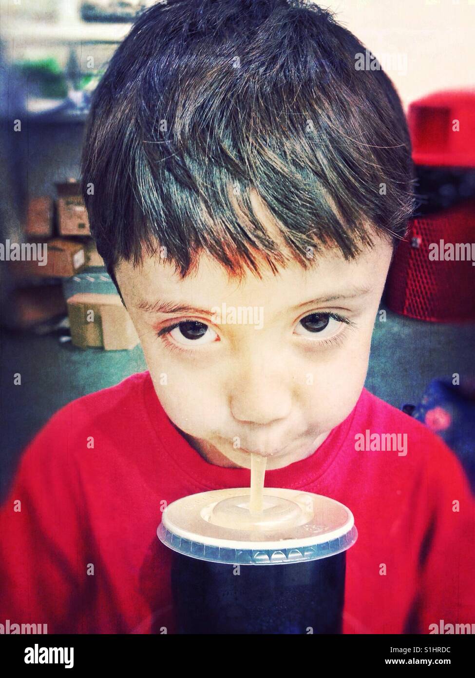 Child Drinking Through A Straw High Resolution Stock Photography and ...