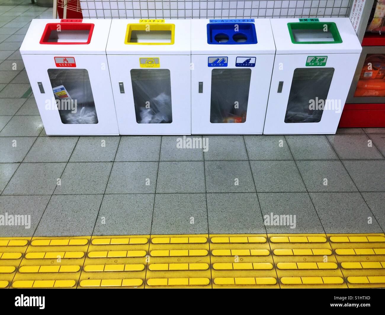 Color coded recycling bins on Kyoto train station Stock Photo - Alamy
