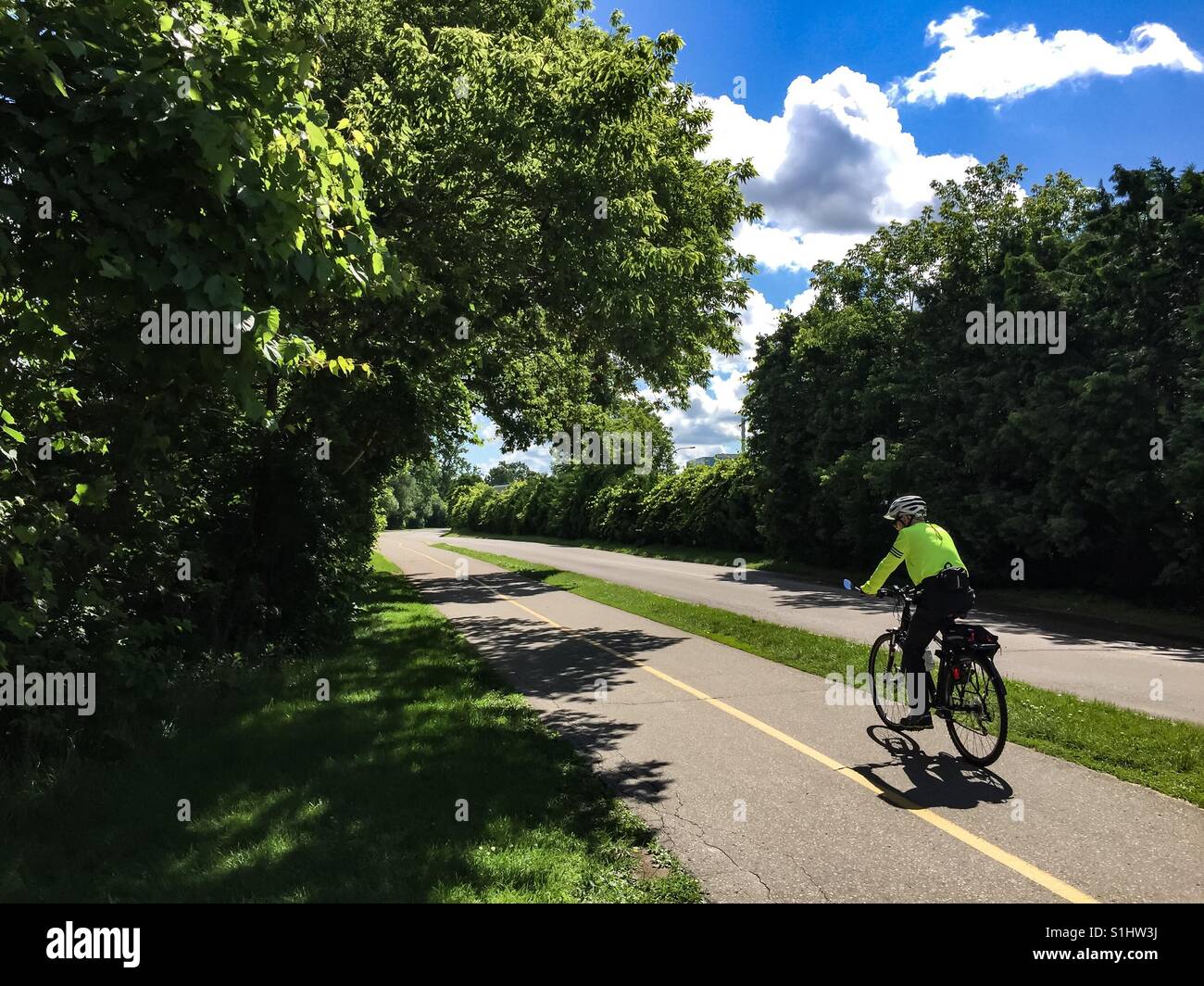 Lone cyclist on a bike path Stock Photo - Alamy