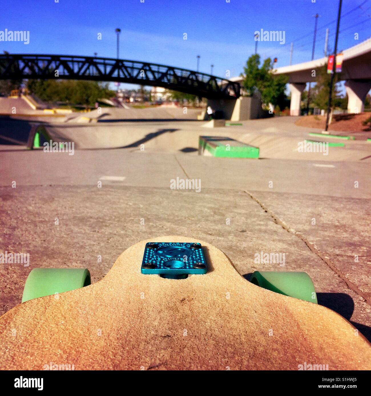 The front end of a skateboard looking out over the skate park Stock ...