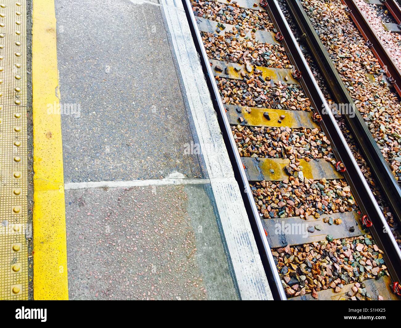 Train platform and rail tracks in London in England Stock Photo - Alamy
