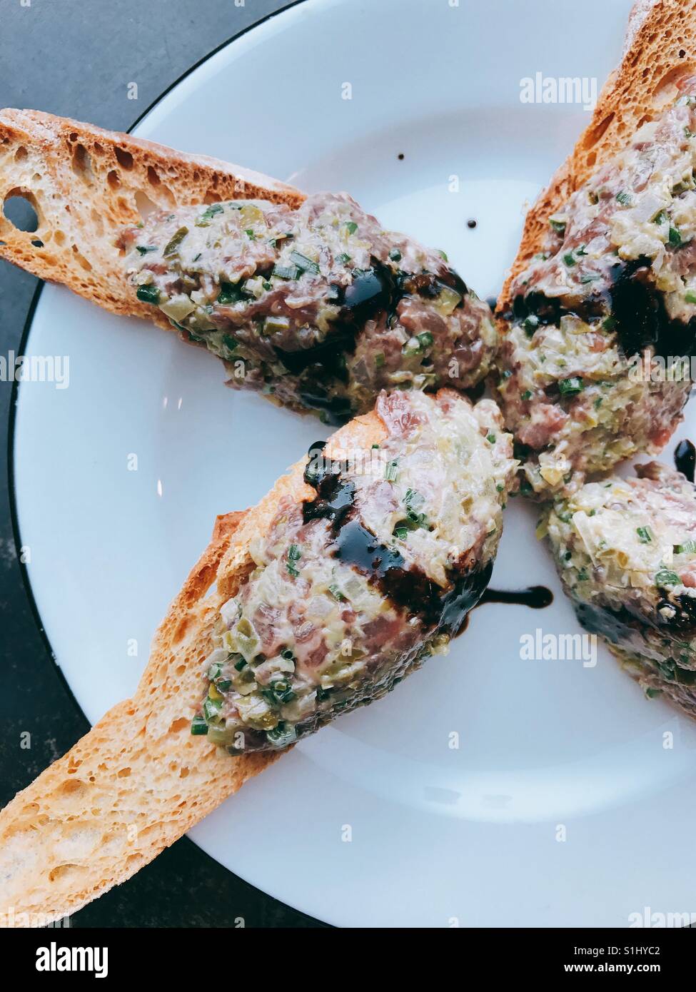 Steak tartare on toast Stock Photo - Alamy