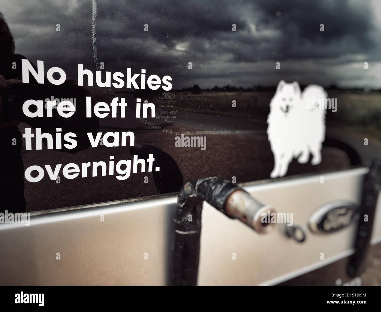 No Huskies are left in this van overnight Stock Photo - Alamy