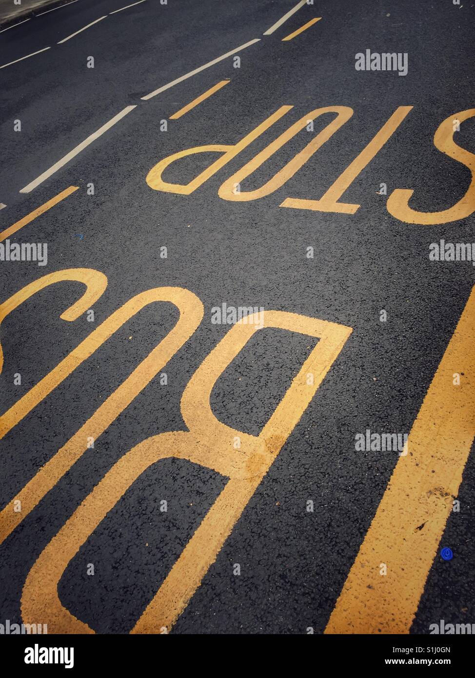 Bus stop marking on road hi-res stock photography and images - Alamy
