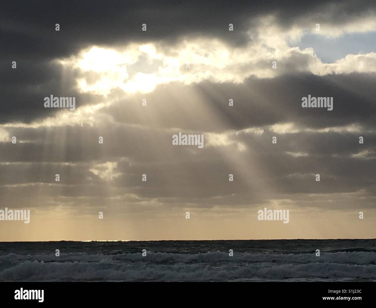Sun Peeking Through The Clouds High Resolution Stock Photography and ...