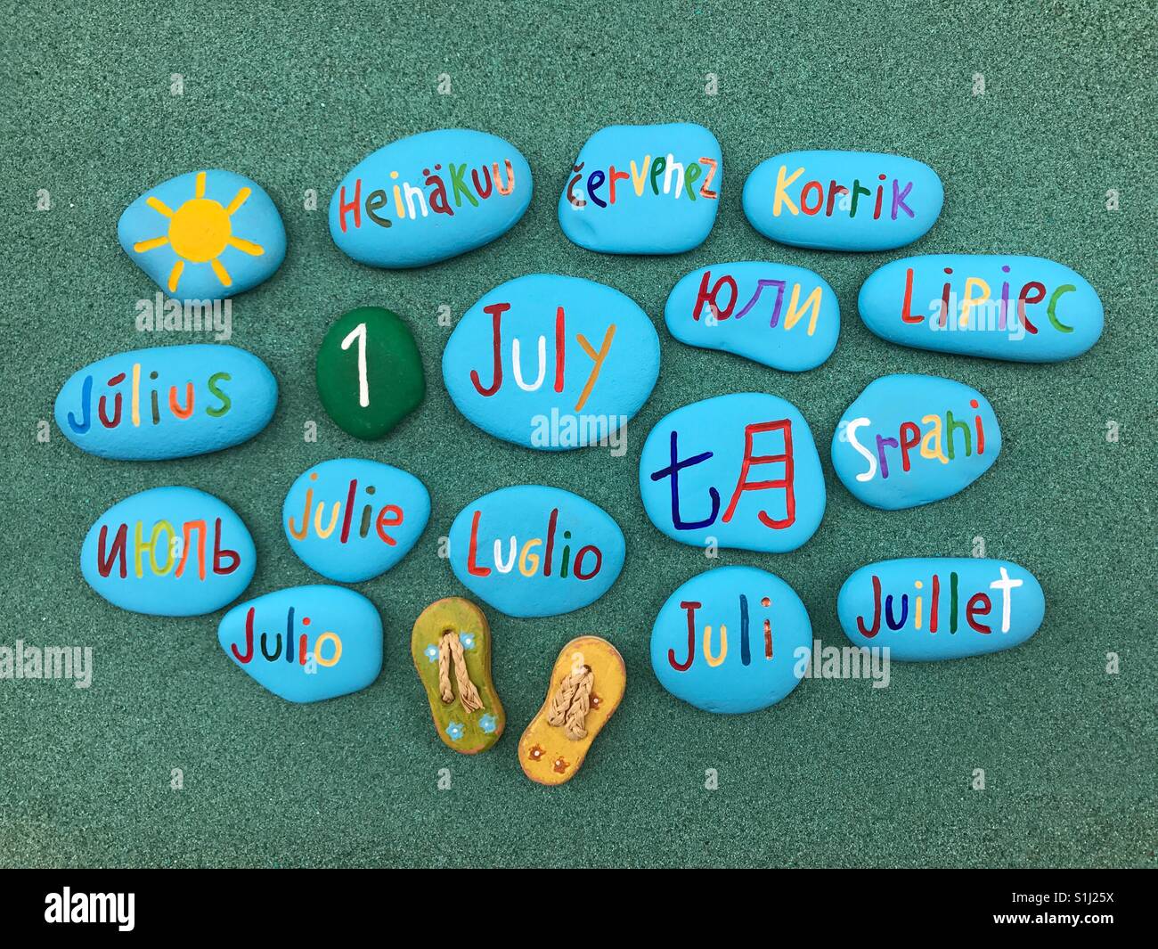 1 July, calendar date in many languages with many carved and colored ...