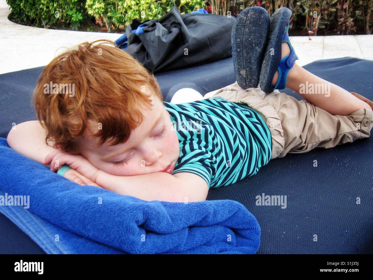 Child asleep outside hi-res stock photography and images - Alamy
