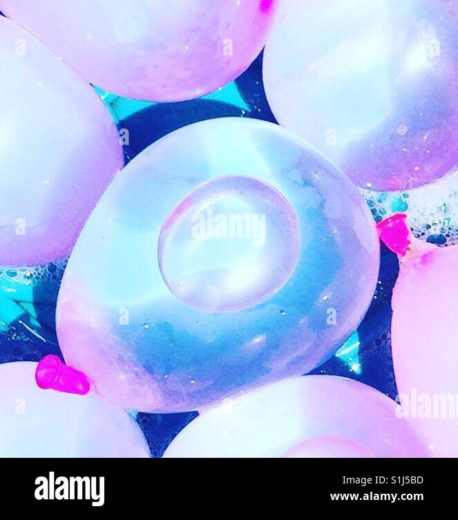 Purple water balloons by K.R Stock Photo - Alamy